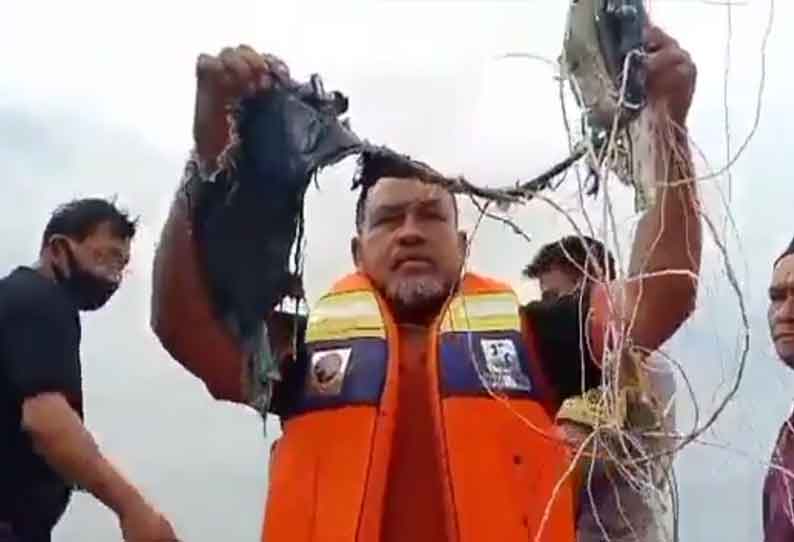 shows debris from Sriwijaya Air flight SJ182 after disappearing from ...